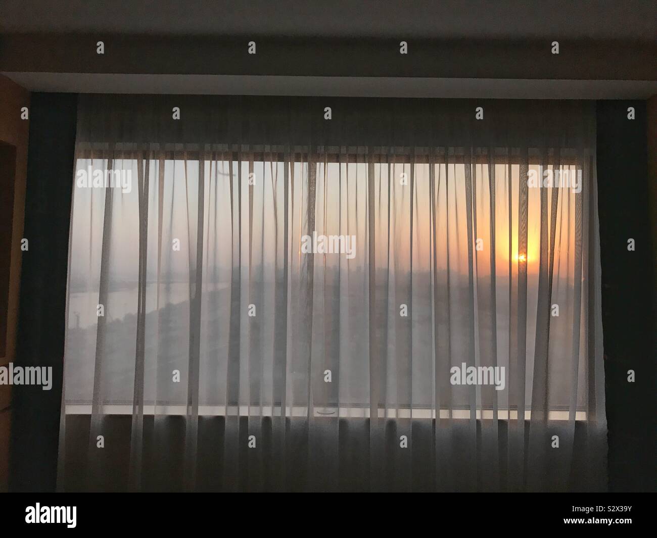 Sunrise from hotel window Stock Photo - Alamy