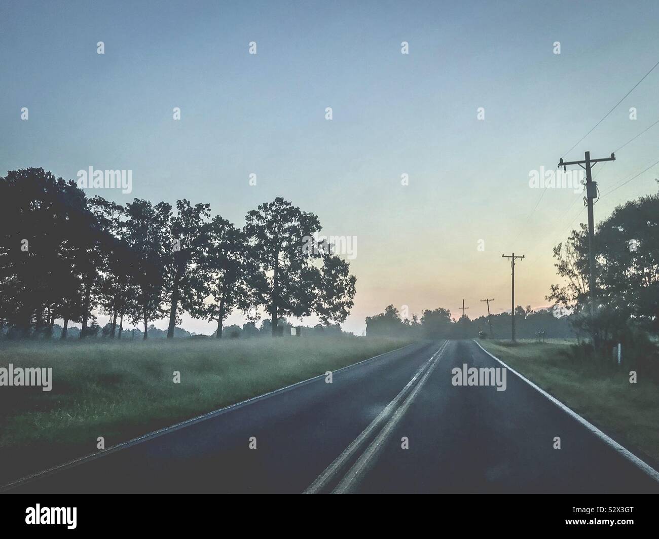 Summer sunrise and mist through the windshield Stock Photo - Alamy