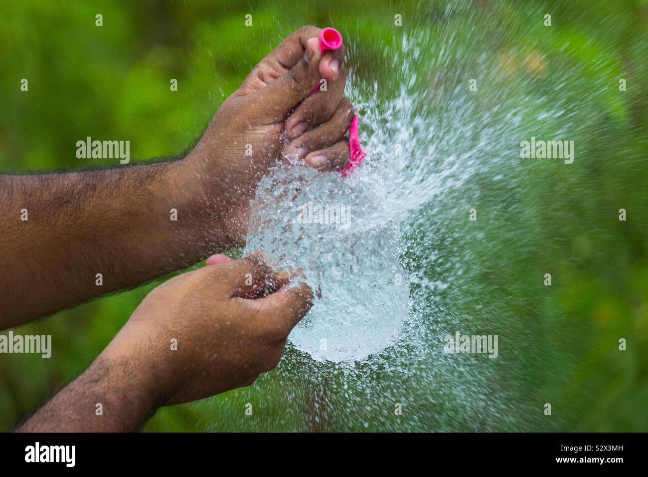 breaking water balloon shot Stock Photo - Alamy