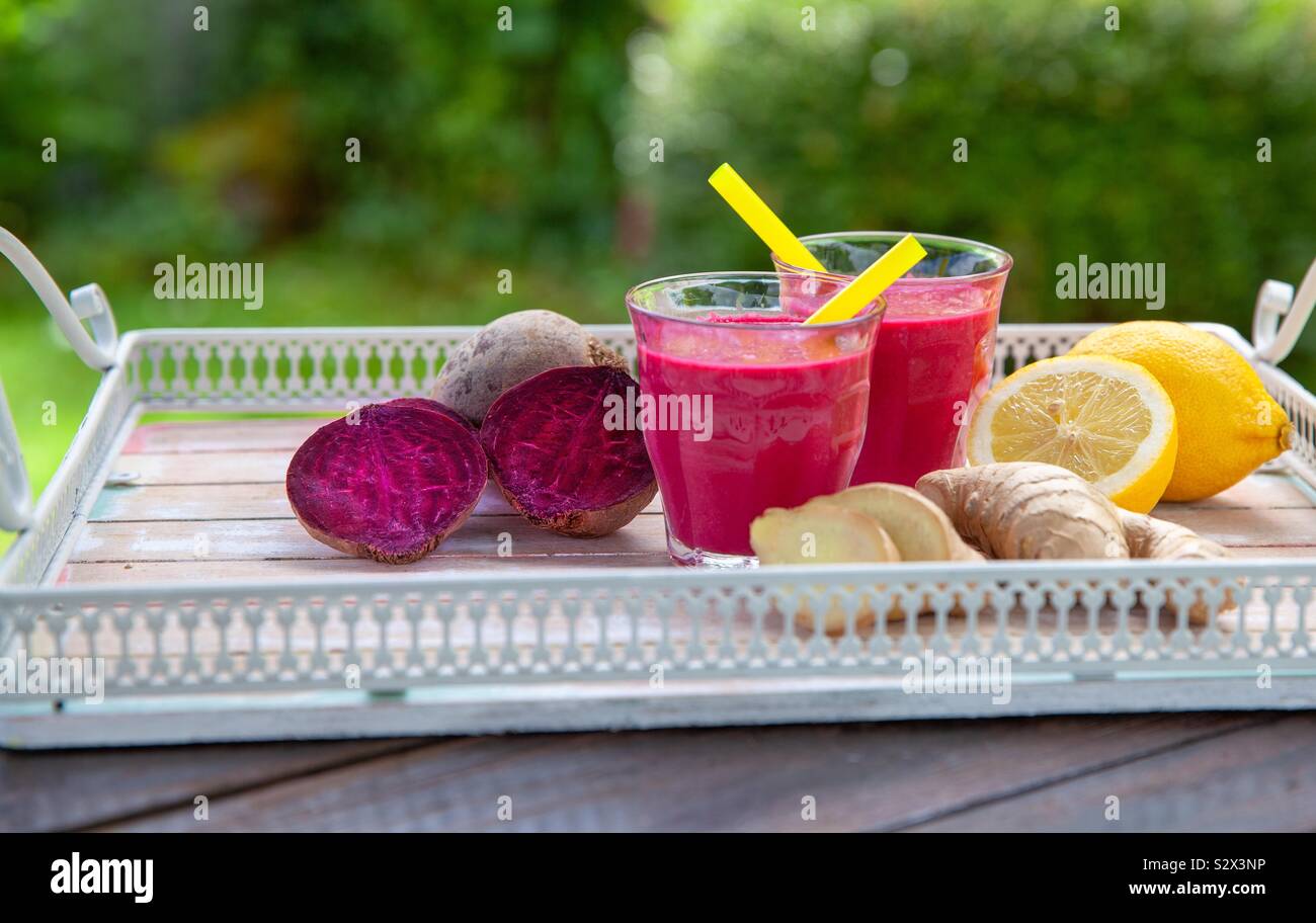 Beetroot and ginger shots on daylight Stock Photo - Alamy