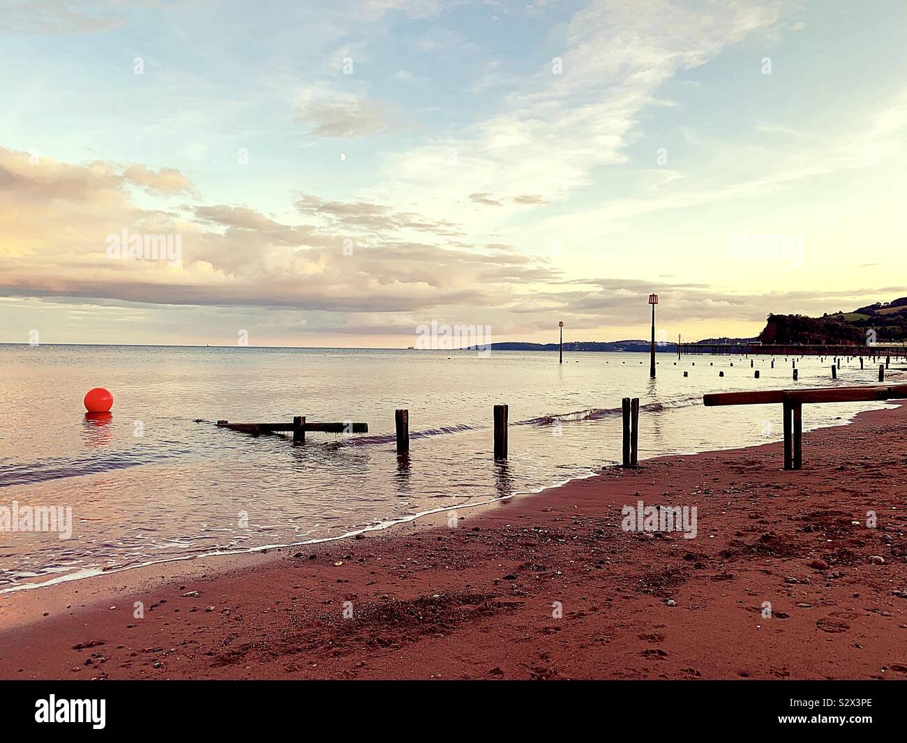 Red sand beach Stock Photo - Alamy