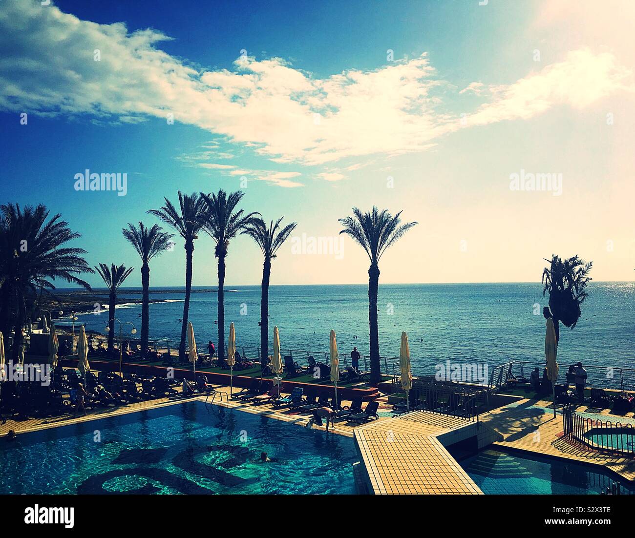 Qwara Palace Hotel, Malta. Swimming pool, ocean and Palm trees Stock ...