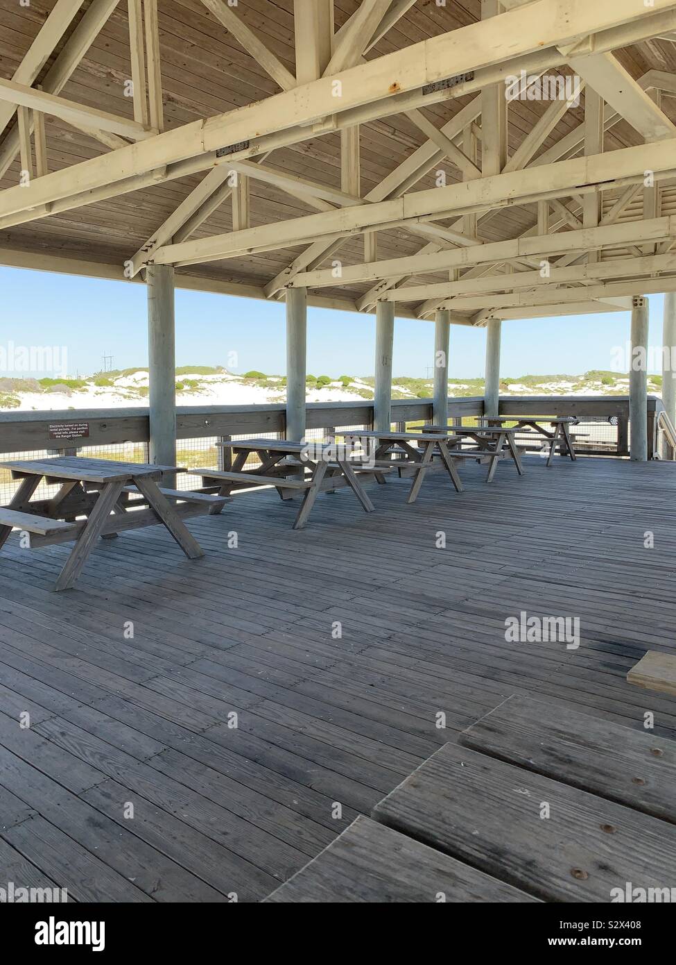 Outdoor pavilion area on the beach with picnic benches and view of ...