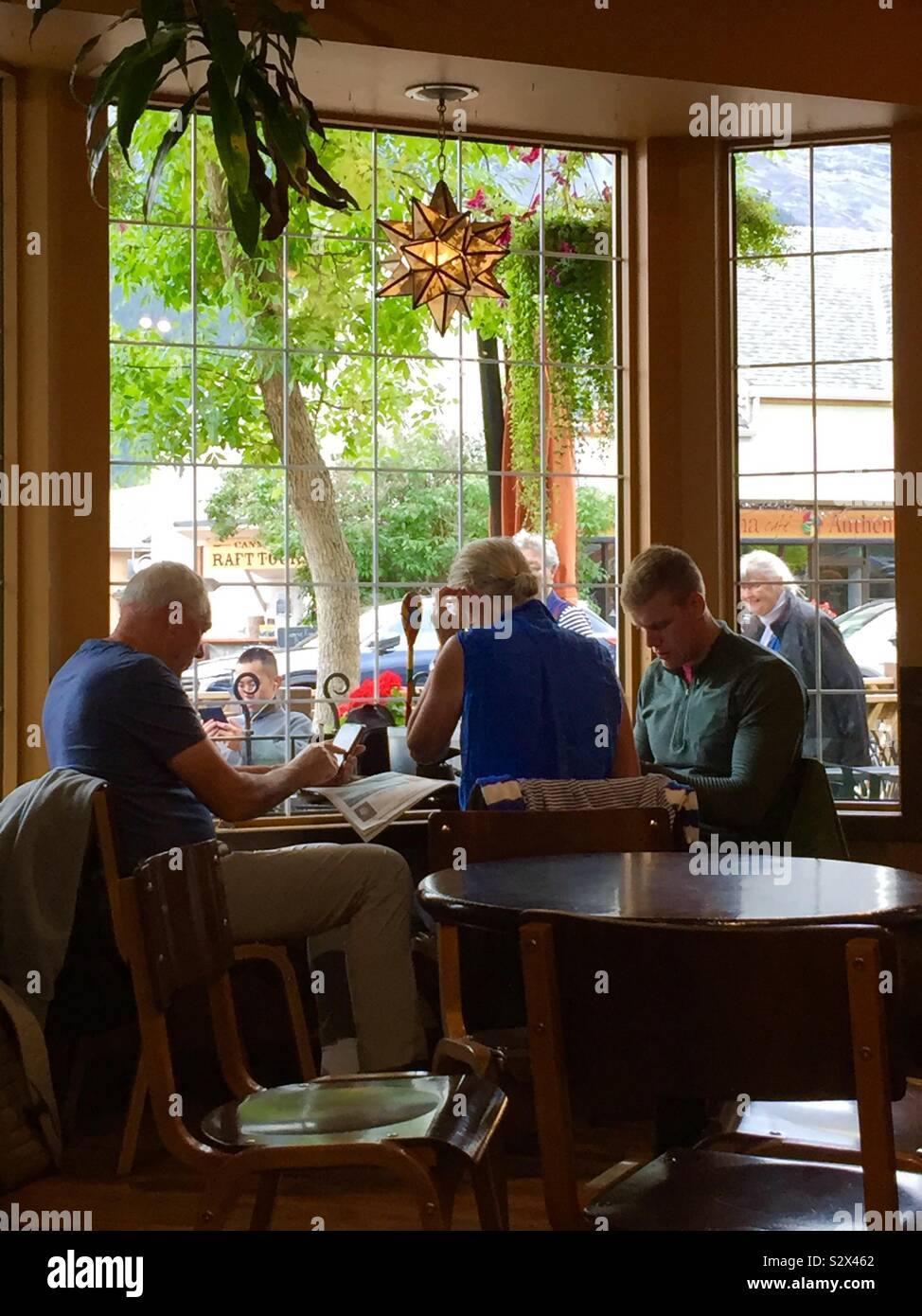 Street photo, Canmore, Alberta, Canada, In the Coffee shop Stock Photo ...