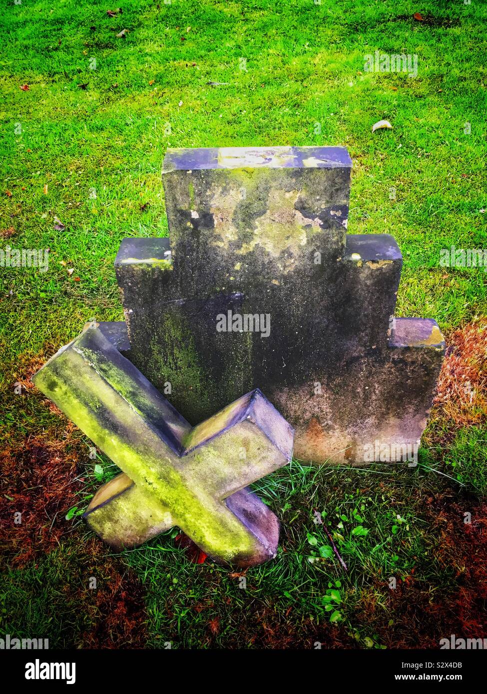 Fallen cross in grave yard Uk Stock Photo - Alamy