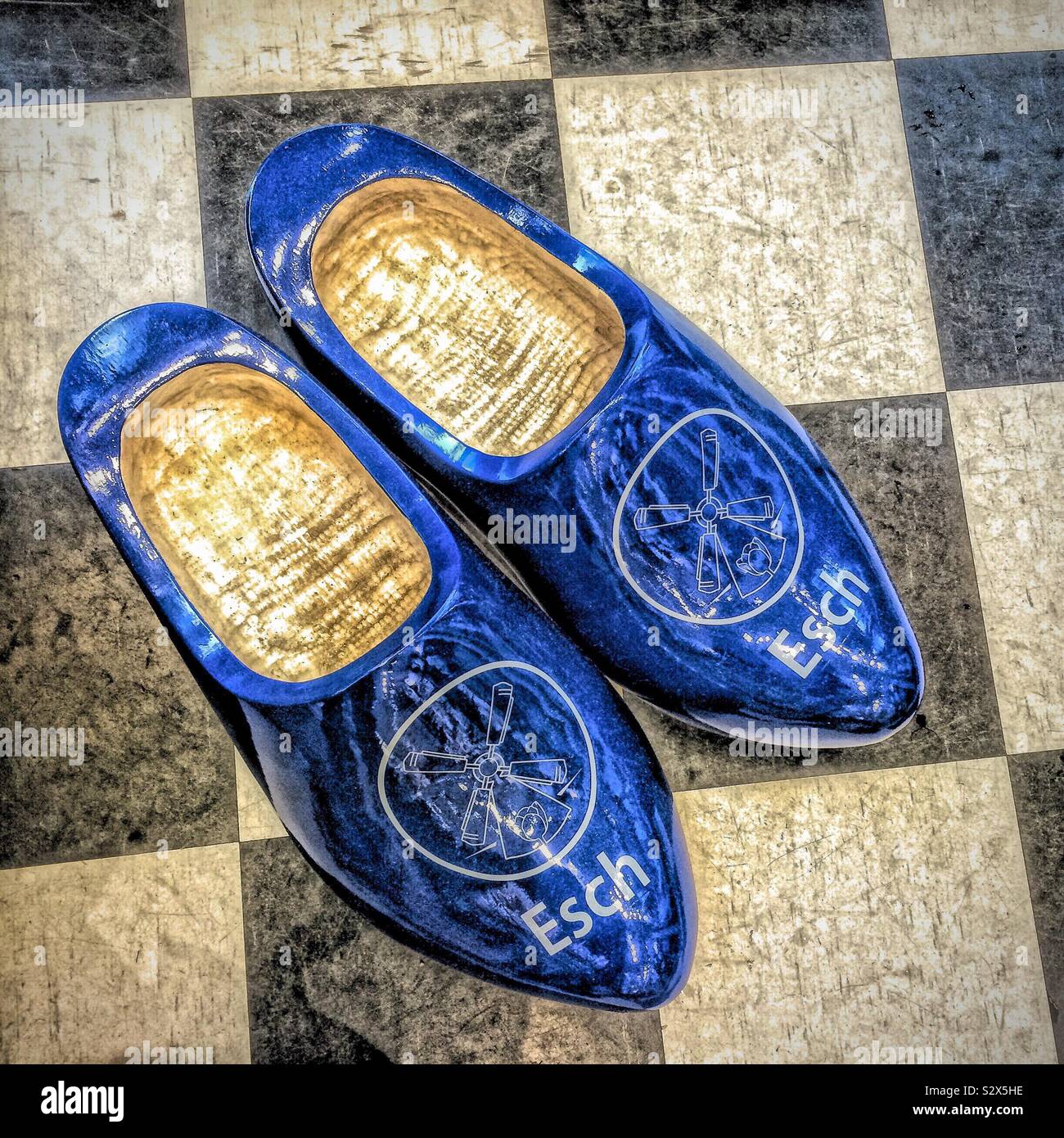 Looking down on a pair of giant Wooden Clogs, marked with Esch, which a ...