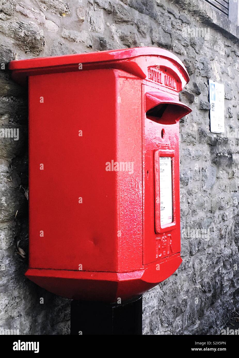 Red british post box in a city street hi-res stock photography and ...