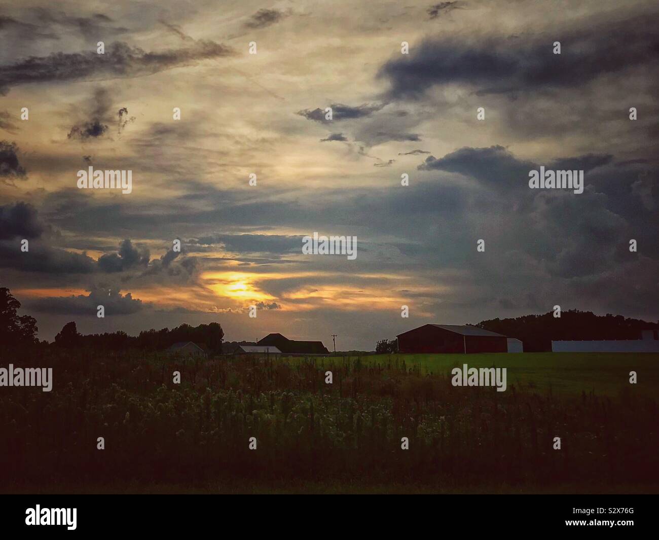 Sunset over North Carolina countryside in July Stock Photo - Alamy