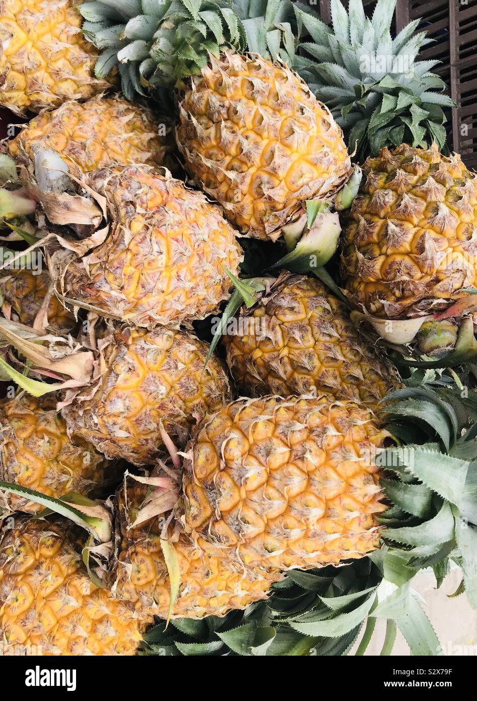 Bunch of pineapple Stock Photo - Alamy