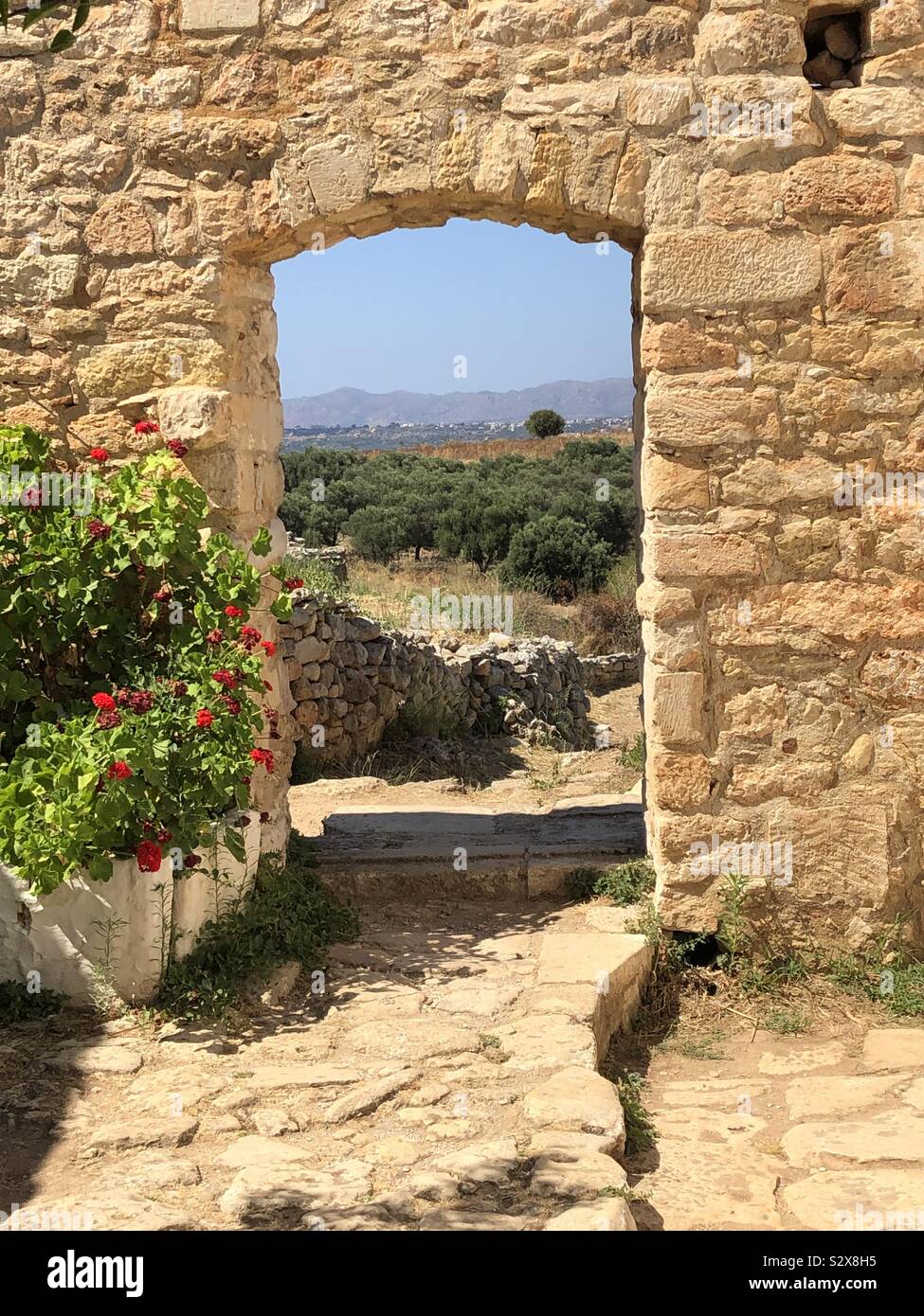 Beautiful Italian countryside view through small brick archway Stock ...