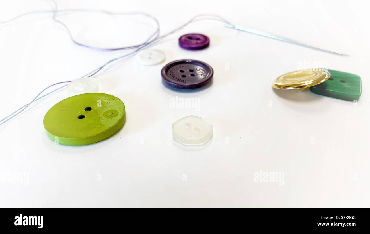 Buttons and thread Stock Photo - Alamy