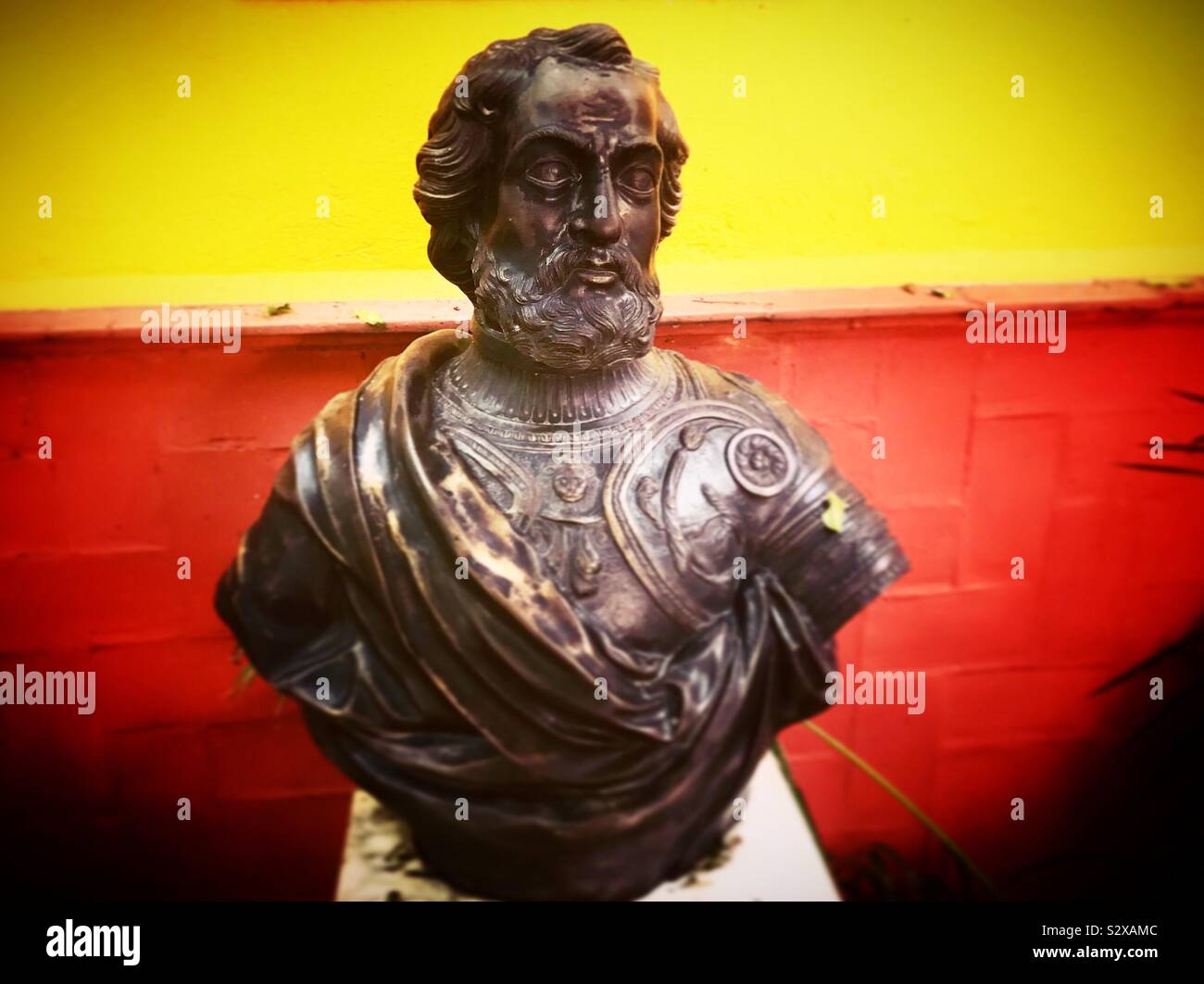 A sculpture of Spanish conqueror Hernan Cortes in front of a wall with ...