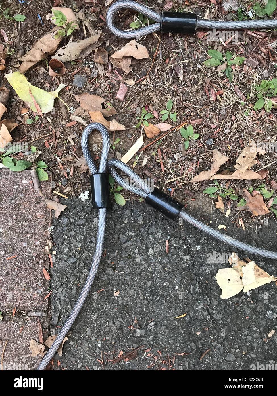 Metal wires to secure garden machinery Stock Photo - Alamy