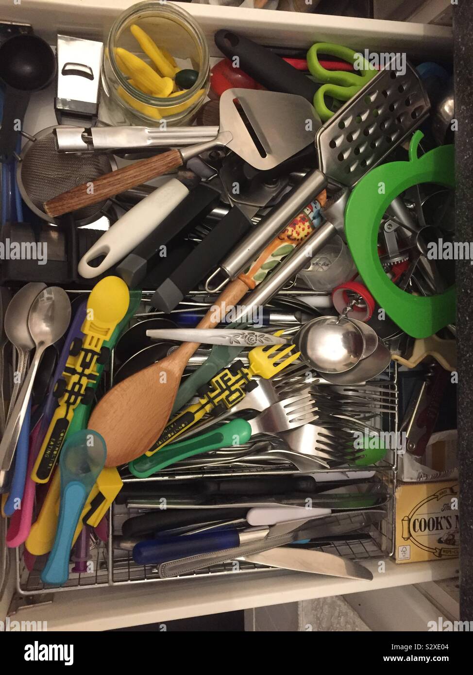 Cluttered kitchen drawer Stock Photo - Alamy