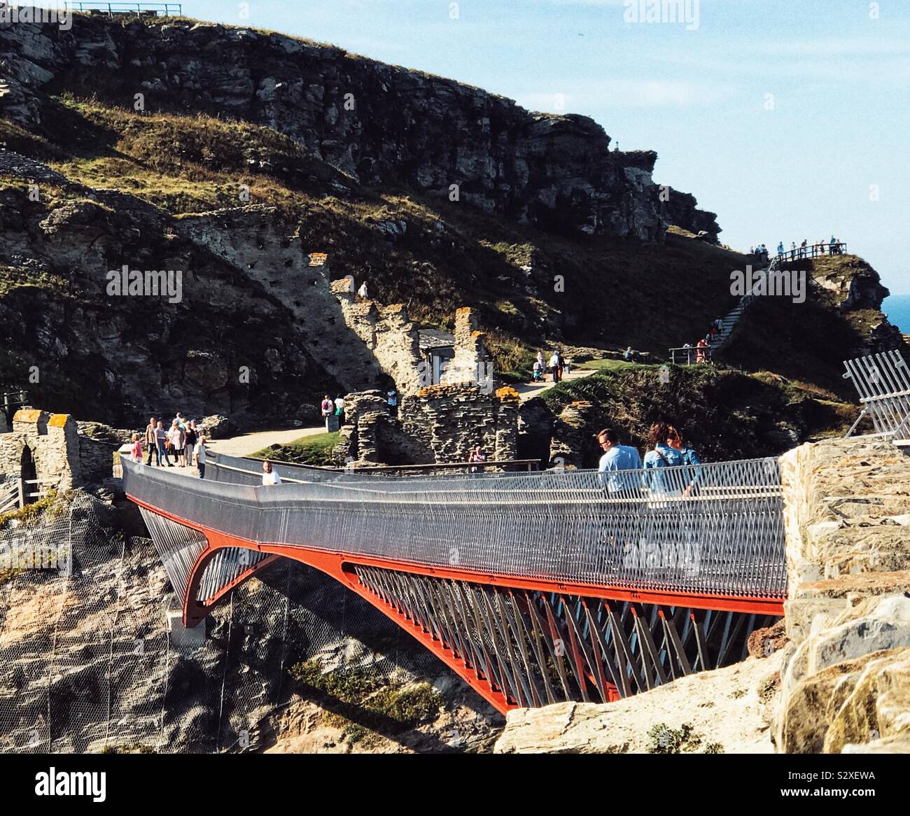 Tintagel Castle Suspension Bridge With People Crossing - Cornwall UK ...