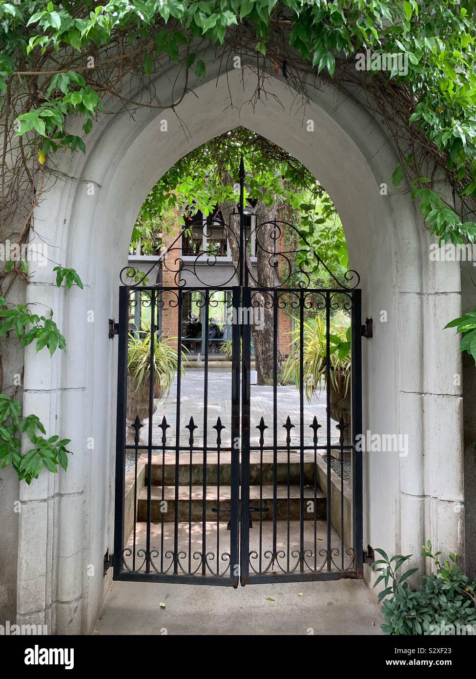 Beautiful gate into a garden Stock Photo - Alamy