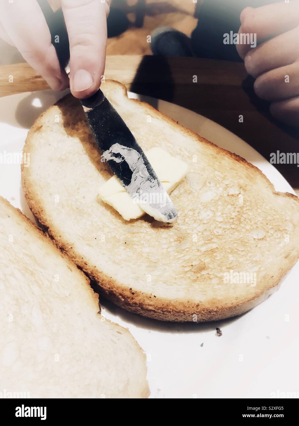 Buttering hi-res stock photography and images - Alamy