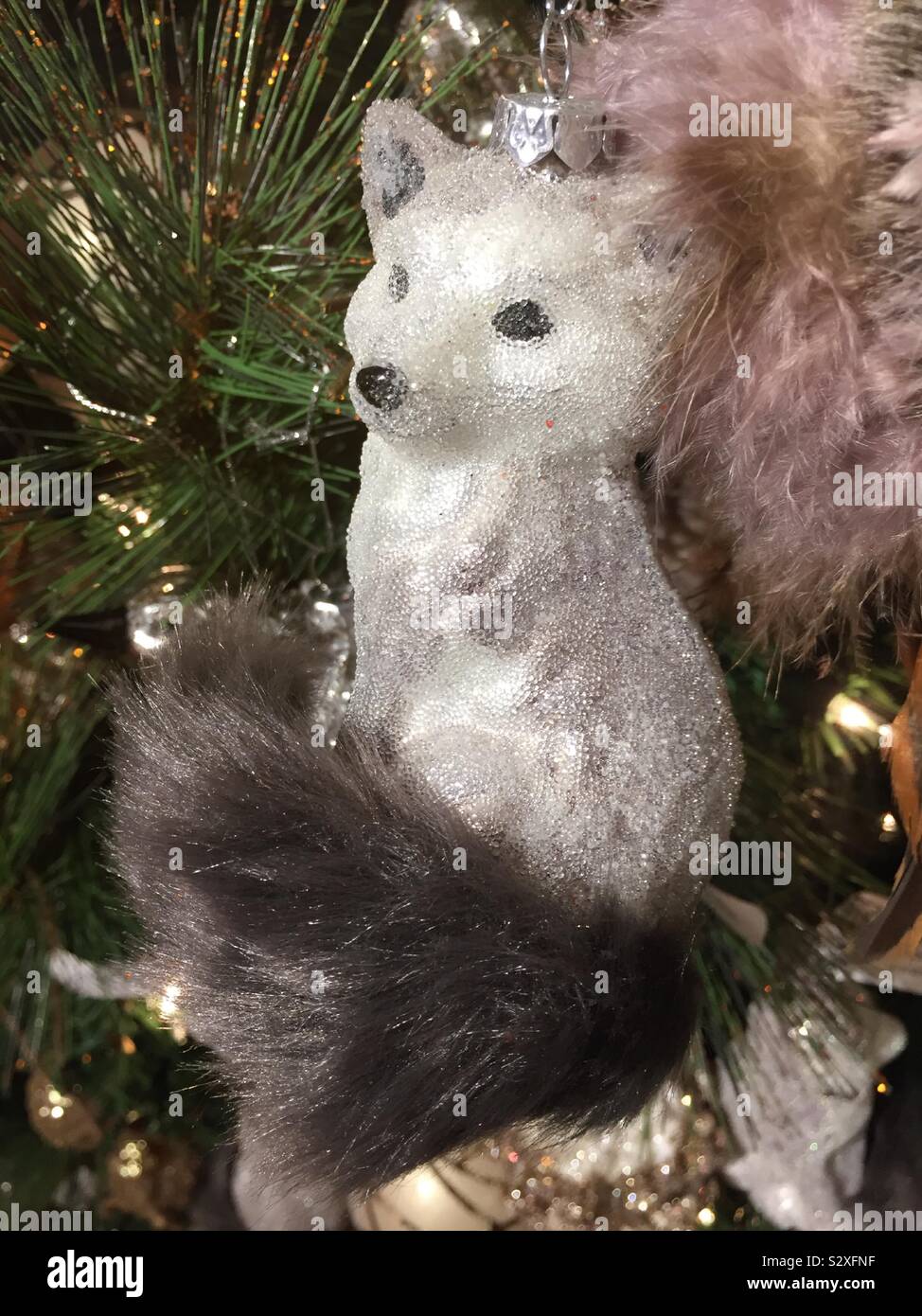 A silver fox Christmas ornament on display in a department store during ...