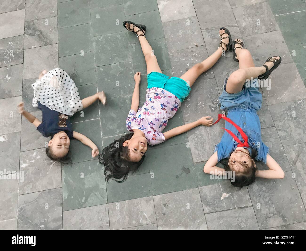 Kids playing on the ground hi-res stock photography and images - Alamy