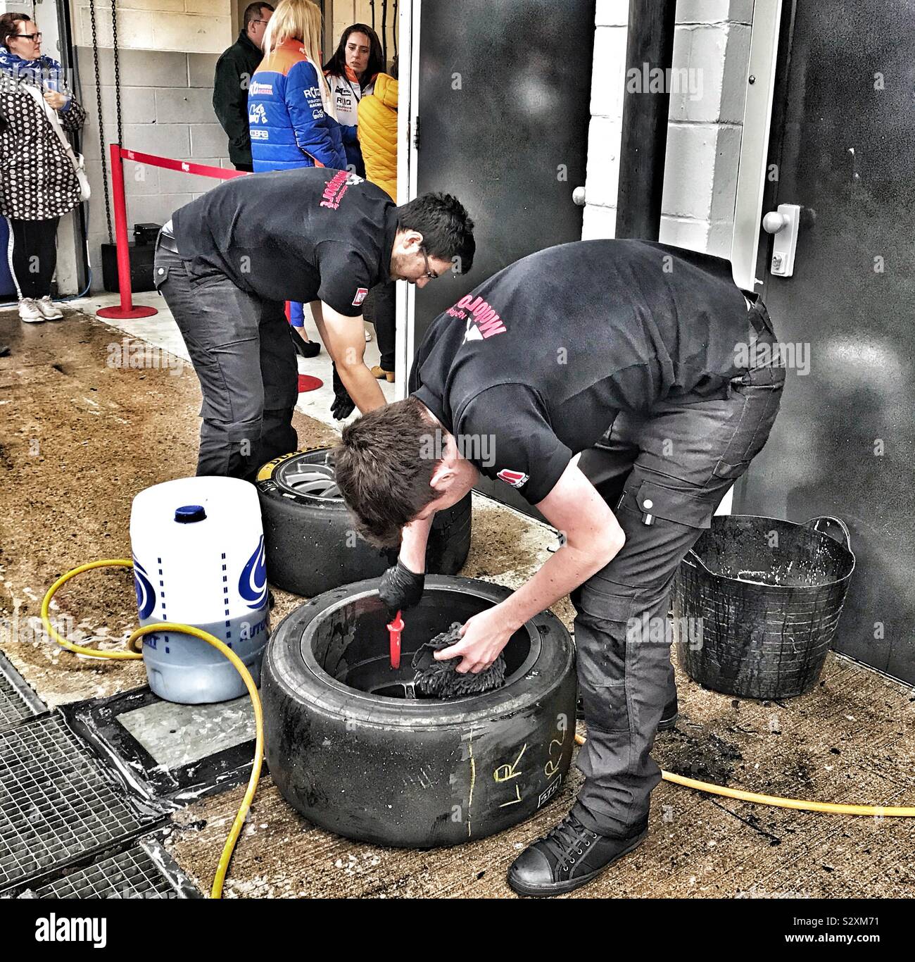 Two Men Washing Wheels At The BTCC - Silverstone UK 2019 Stock Photo ...