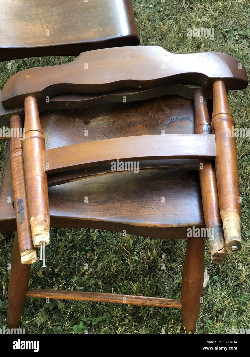 Old wooden chairs with back laying in the seat Stock Photo - Alamy