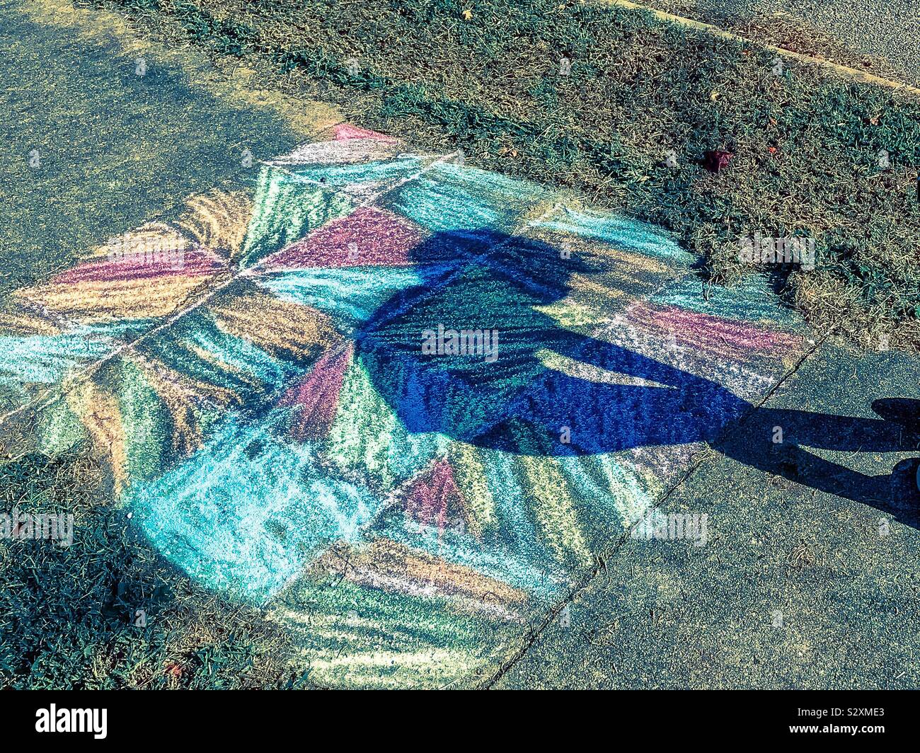 Girl’s shadow on sidewalk chalk drawing Stock Photo - Alamy