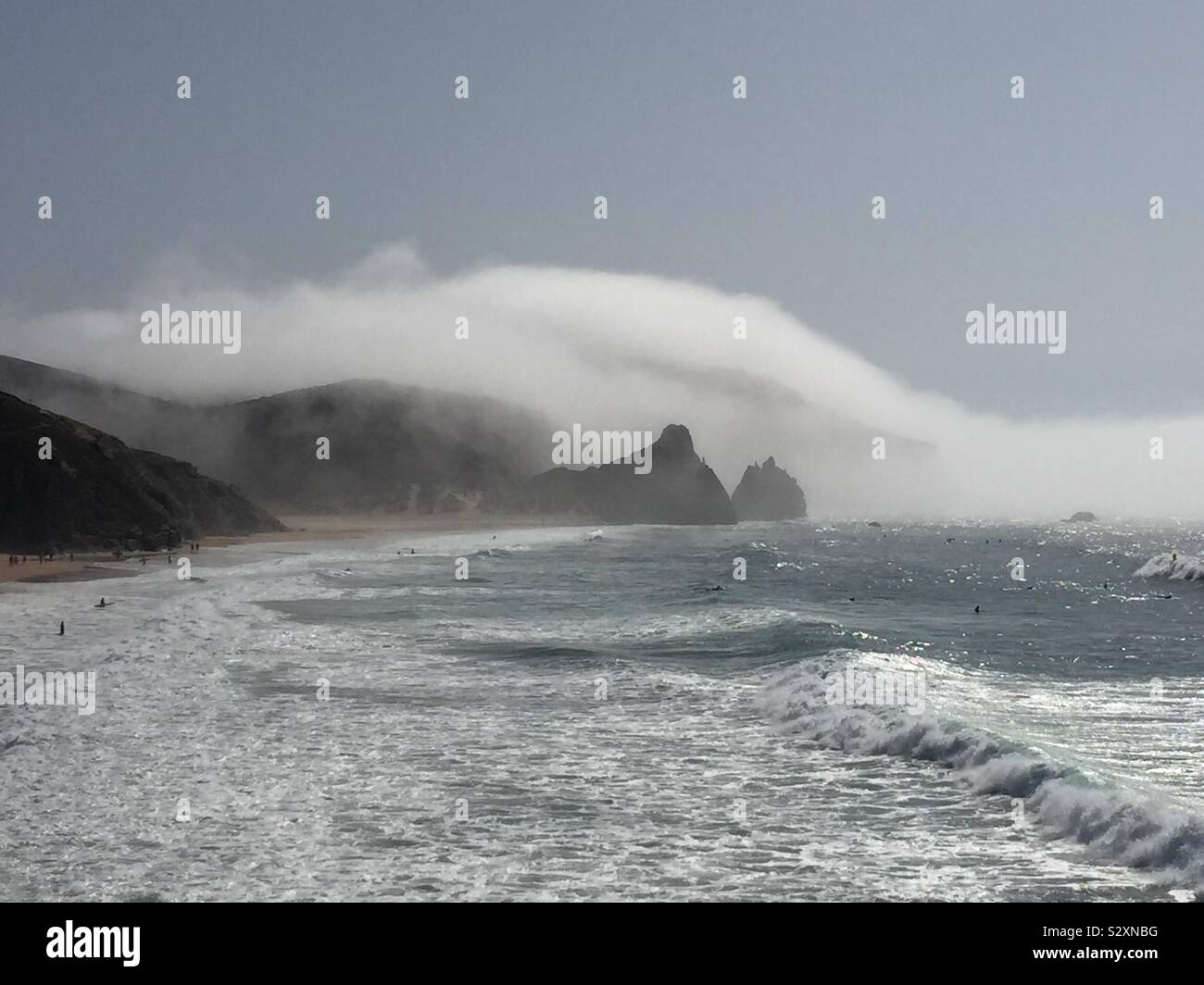 Mist coming in over the coast Stock Photo - Alamy