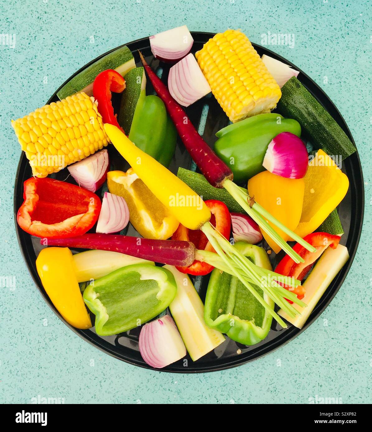 Fresh vegetables heading for the oven to be roasted Stock Photo - Alamy