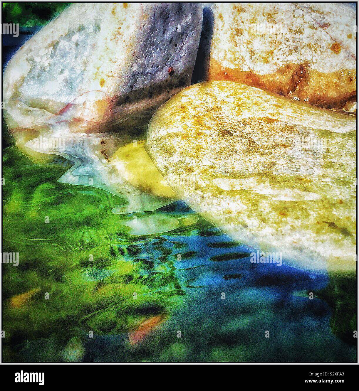 Reflections in a rock pool Stock Photo - Alamy