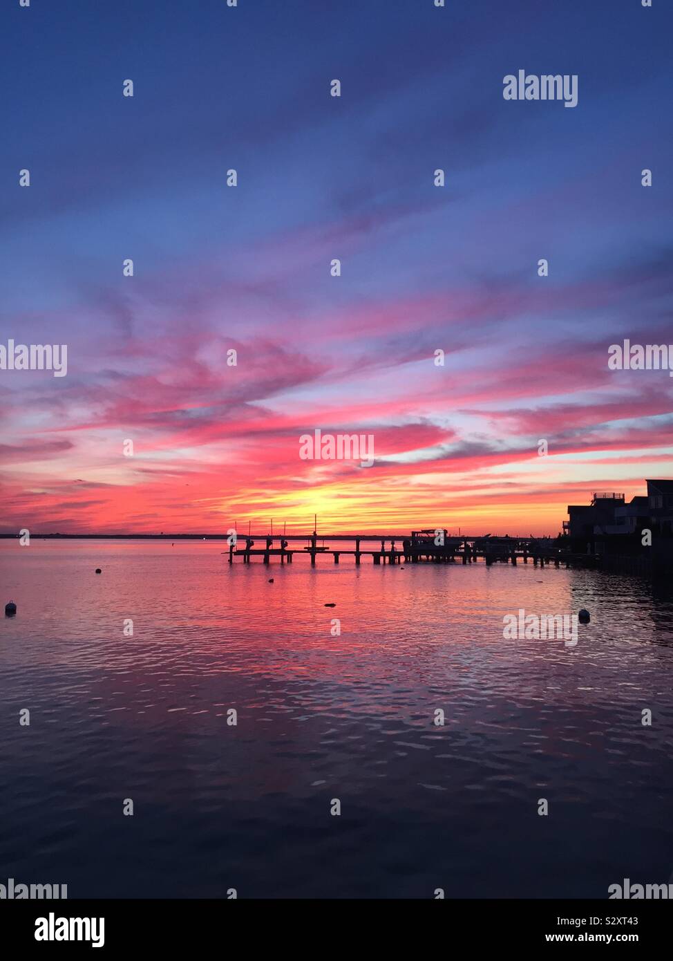 Pink Sunset and Calm Waters in Surf City, New Jersey Stock Photo - Alamy