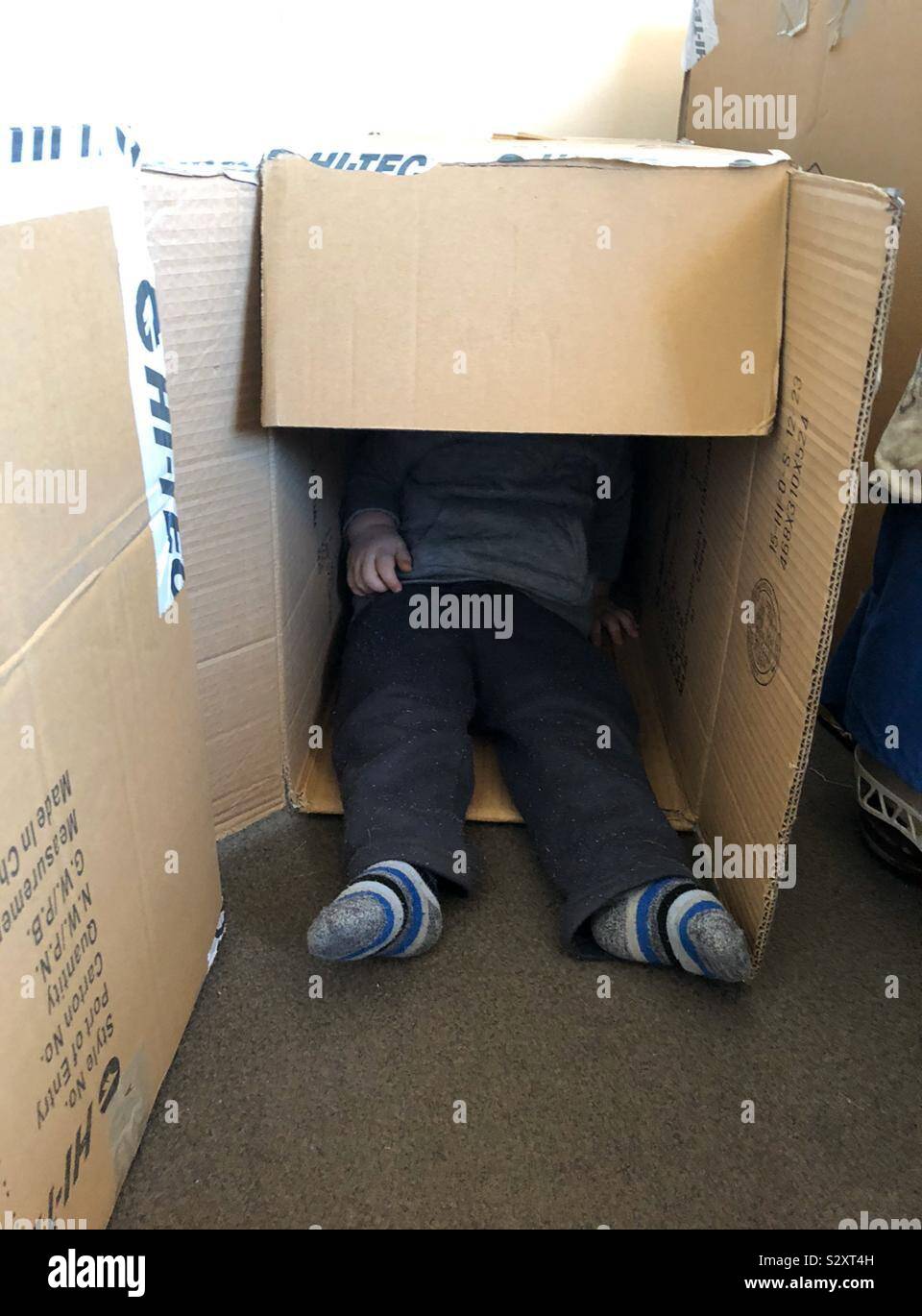 Young boy explores box hi-res stock photography and images - Alamy