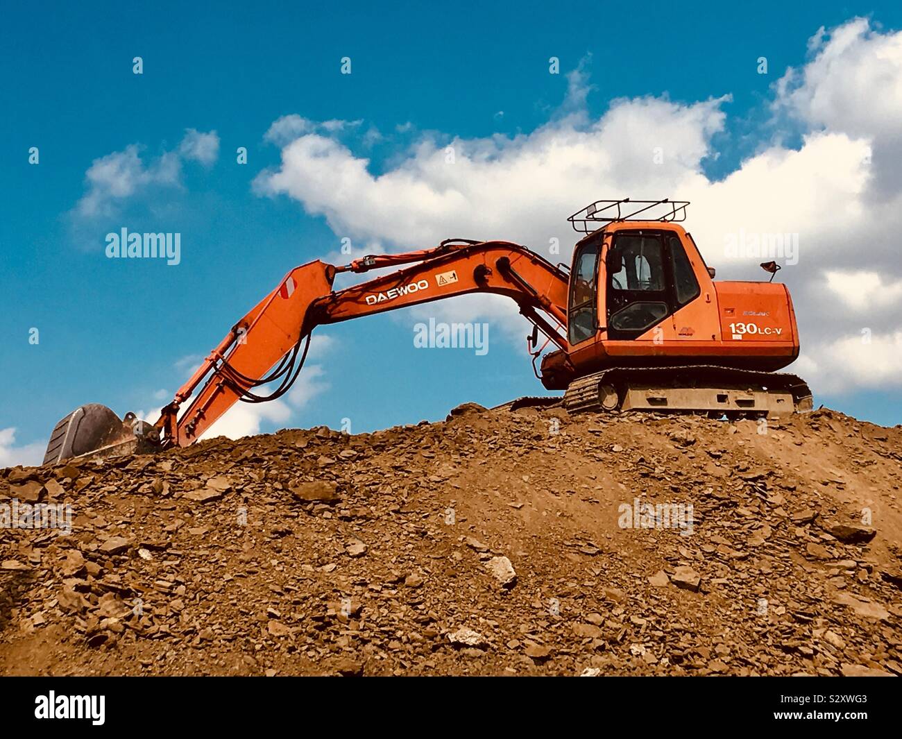 Orange digger hi-res stock photography and images - Alamy