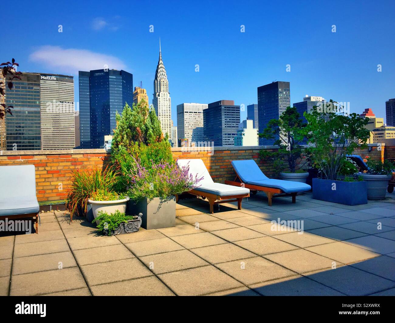 The midtown Manhattan skyline is seen from an apartment buildings roof ...