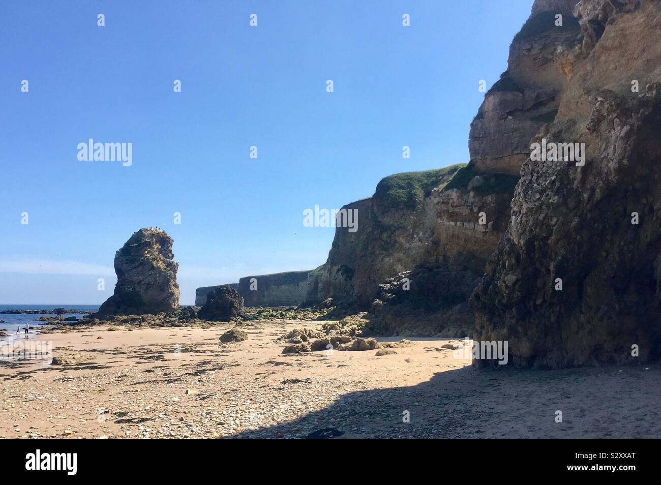 Sand Beach With Cliff Stock Photo - Alamy