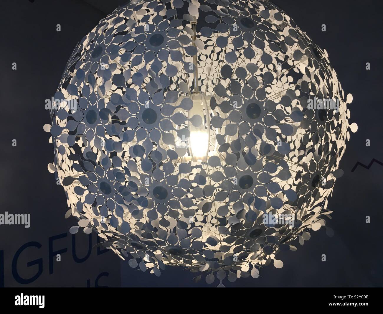 Source of light surrounded by paper leaf globe Stock Photo - Alamy