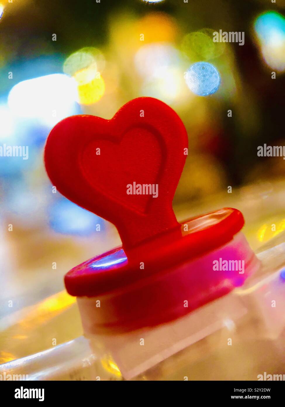 Red plastic mini heart Stock Photo - Alamy