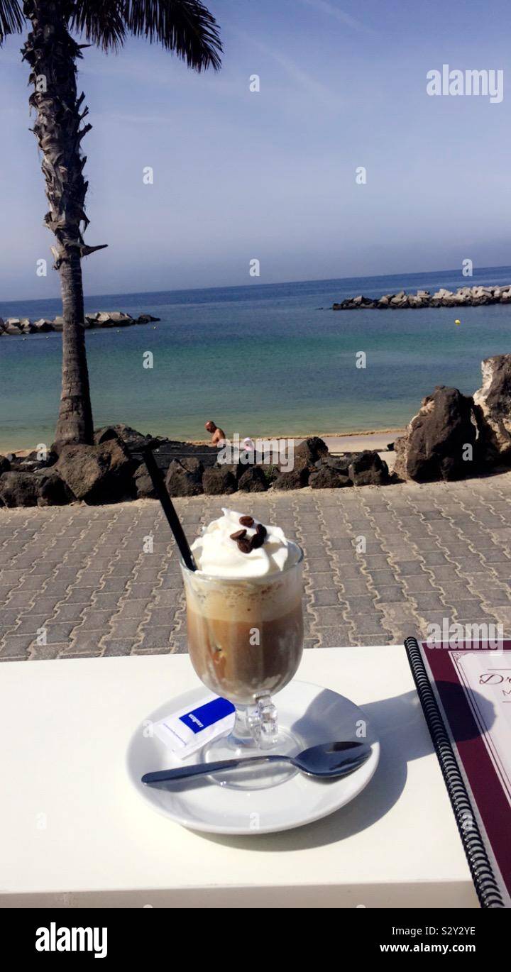 Iced coffee by the sea Stock Photo - Alamy
