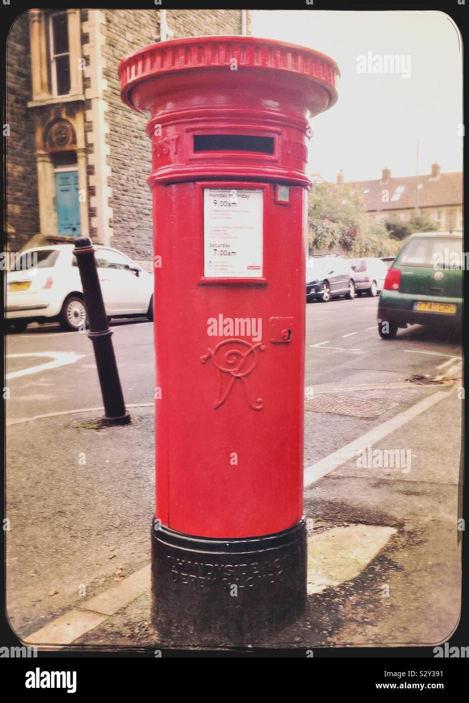 Red british post box in a city street hi-res stock photography and ...