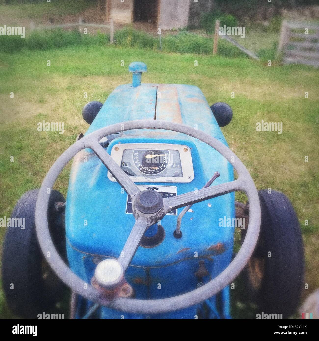 Vintage blue tractor on a farm Stock Photo - Alamy