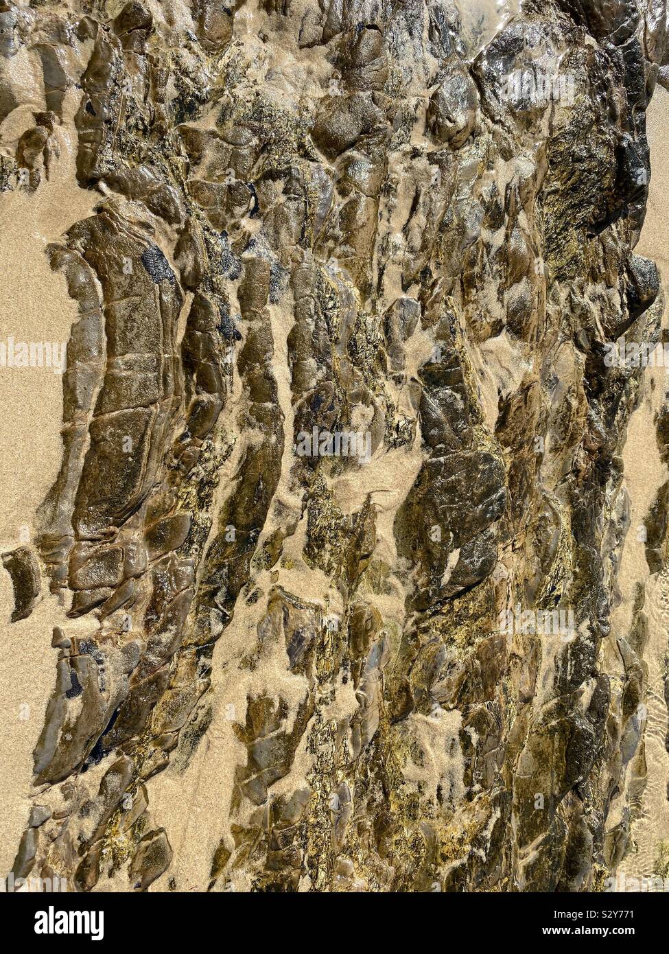Close up of rock formations textures and patterns on beach in ...