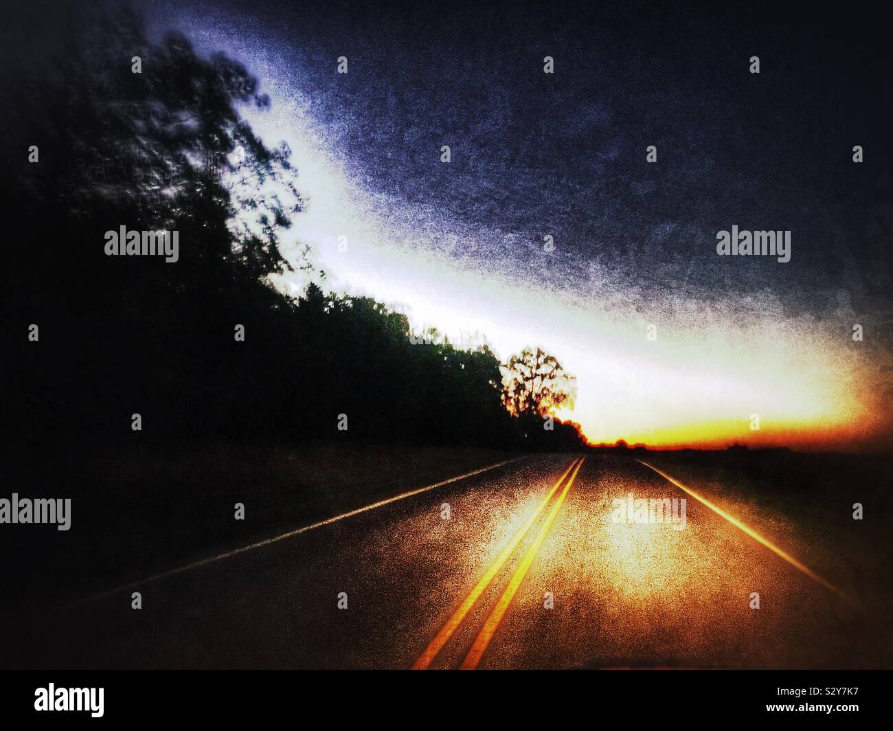 Grunge photo of paved road at dawn Stock Photo - Alamy