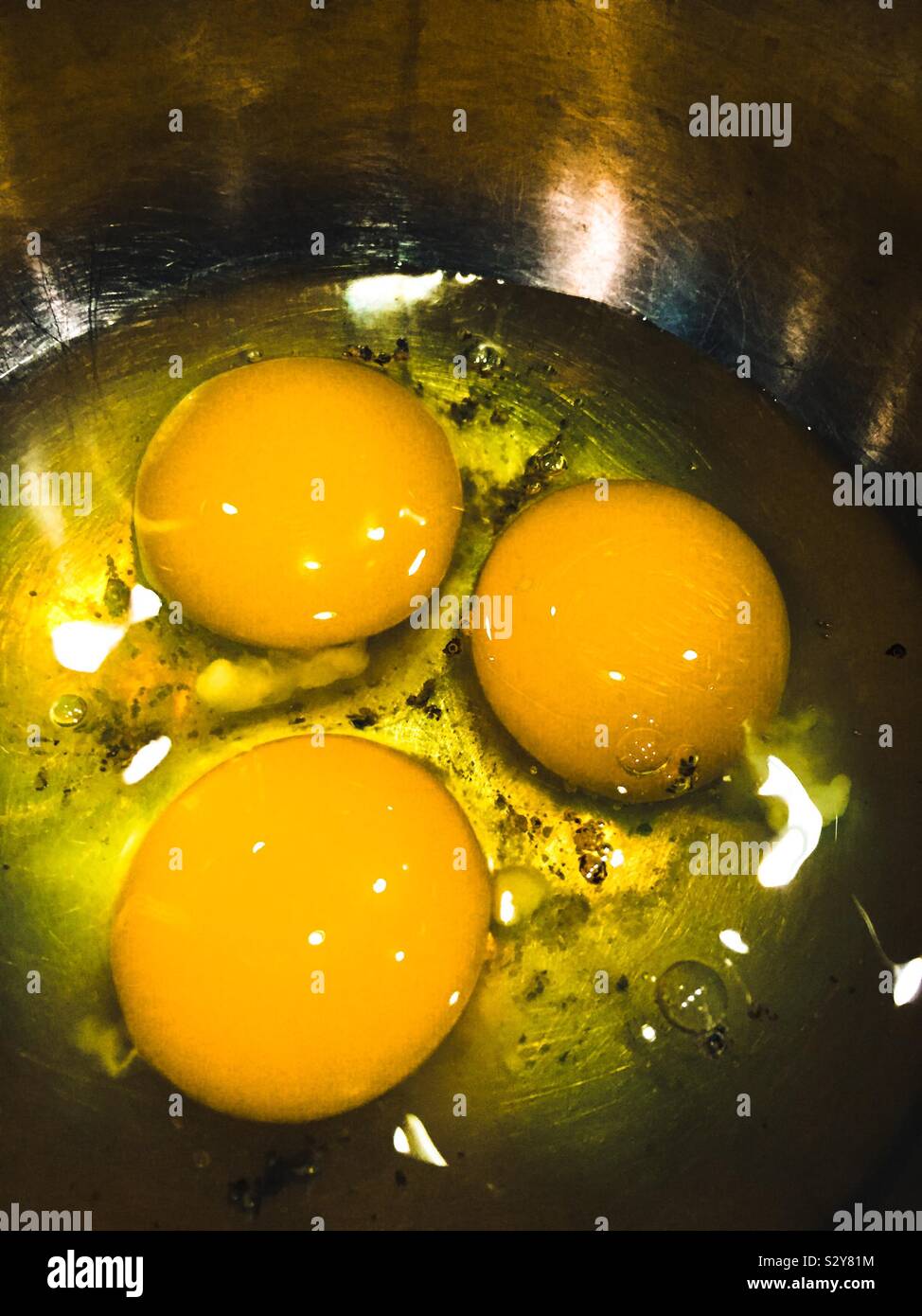 Three egg yolks in egg white Stock Photo - Alamy