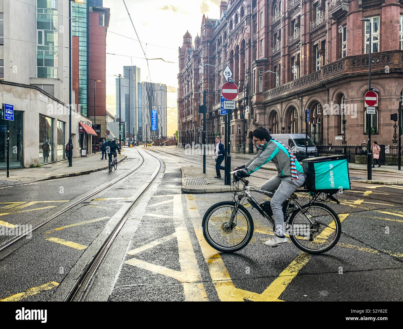 Deliveroo cyclist riding with delivery in Manchester City centre Stock ...