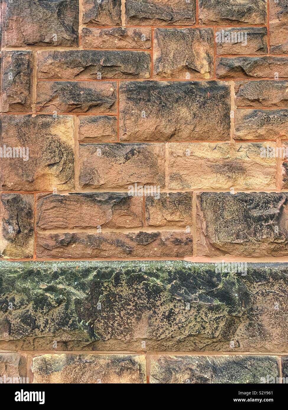 Old smoky stone wall full of character Stock Photo - Alamy