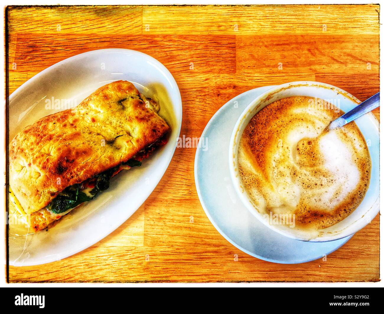 Panini sandwich and cappuccino coffee Stock Photo - Alamy
