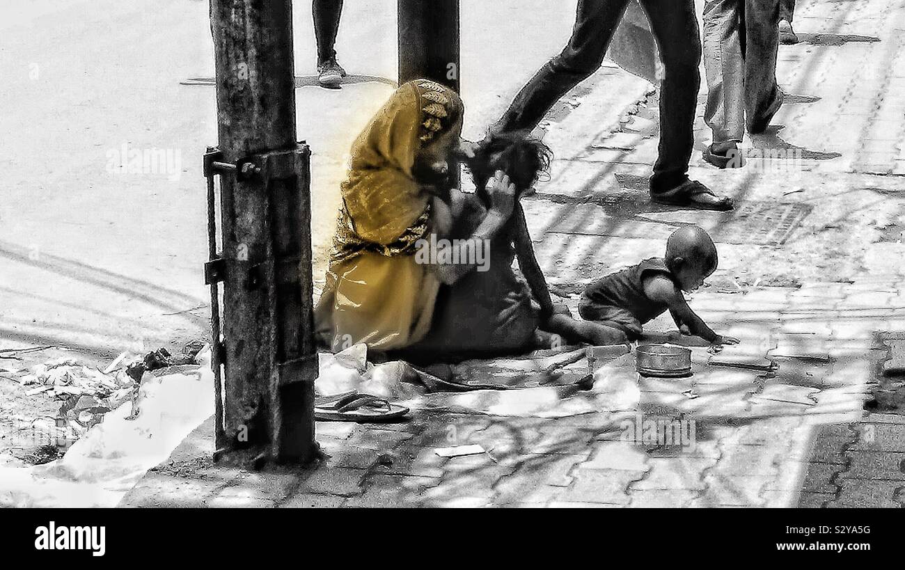 Indian beggars in Kathmandu trying to make do Stock Photo - Alamy