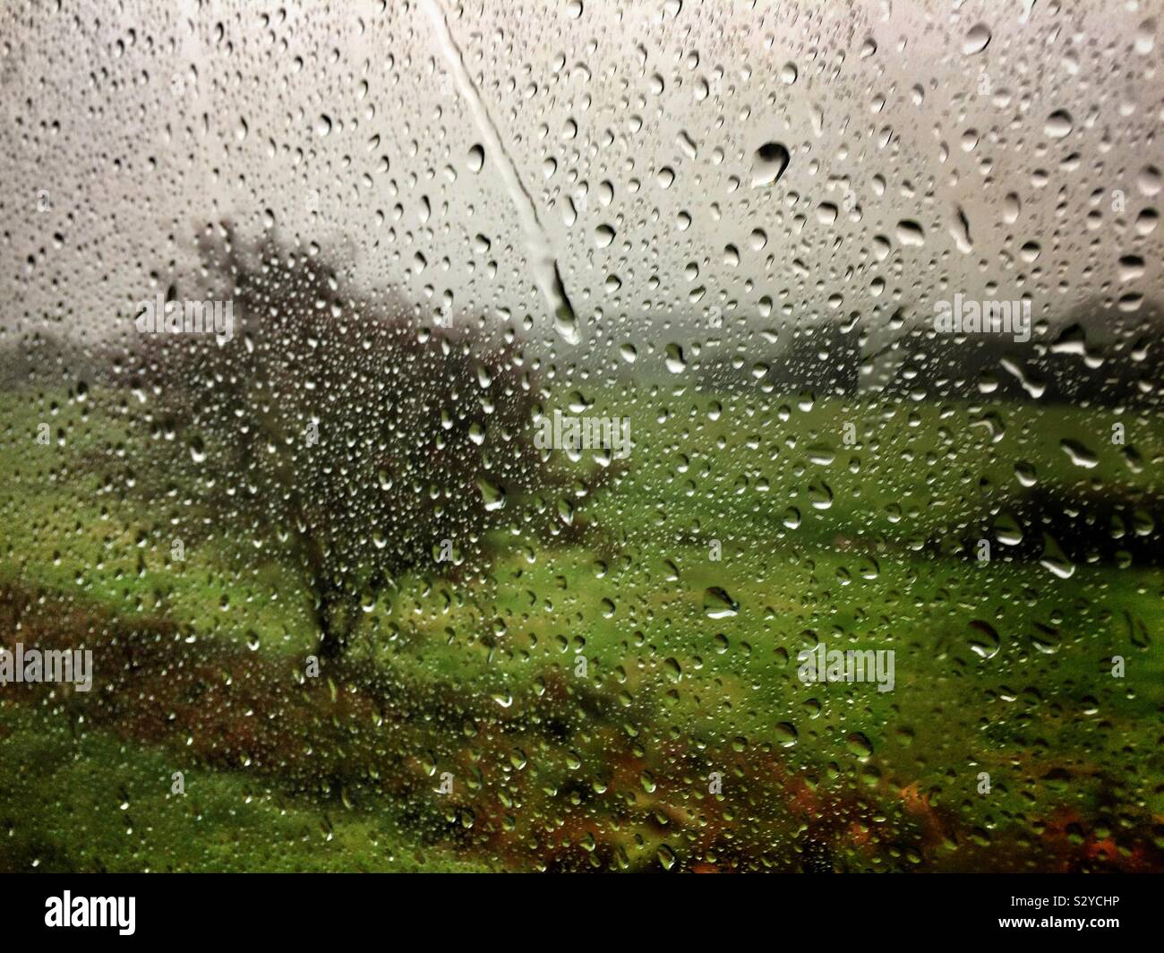 Rainy weather landscape through window hi-res stock photography and ...