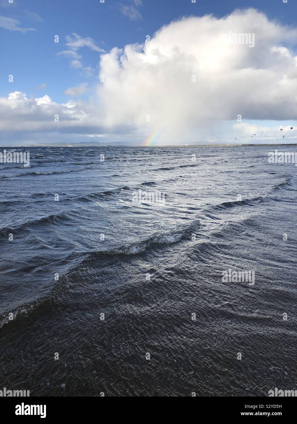 Rainbow over the sea Stock Photo - Alamy