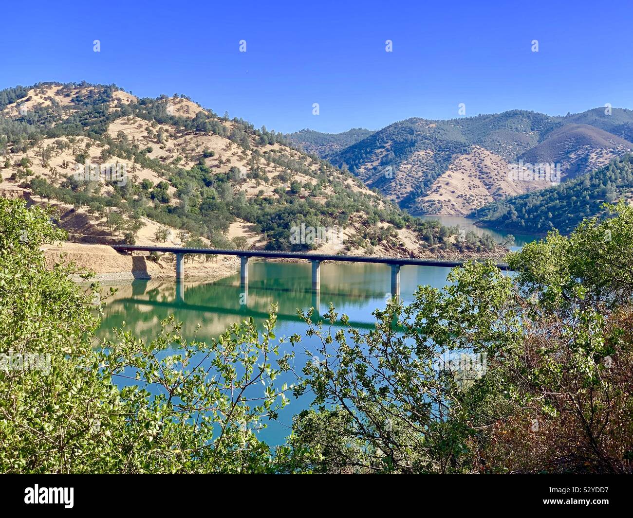Bridge over canyon and lake Stock Photo - Alamy