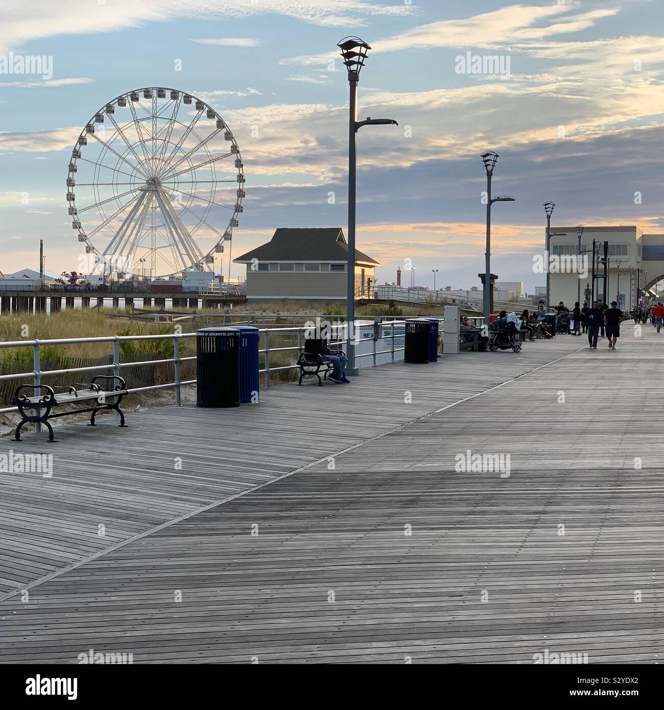 Sunset view from the Boardwalk towards the Wheel at Steel Pier ...